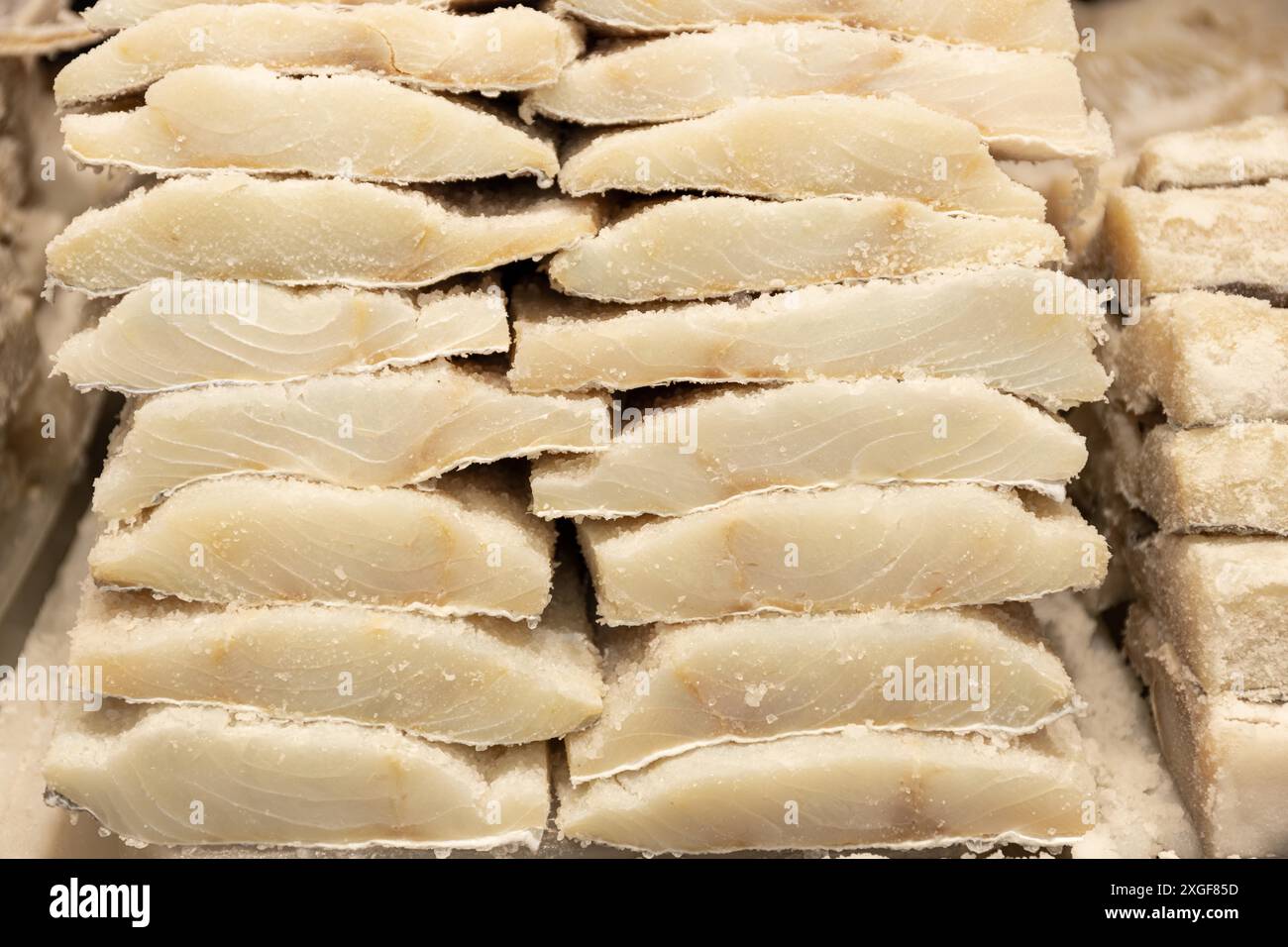 Pile of Dried salted cod at fish shop. Typical spanish and portuguese ...