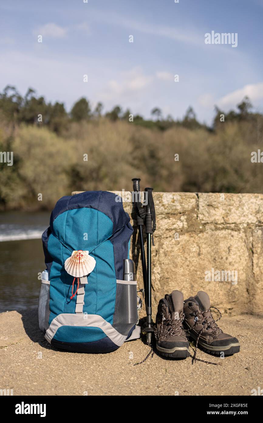 Backpack with seashell symbol of Camino de Santiago, trekking boots and ...