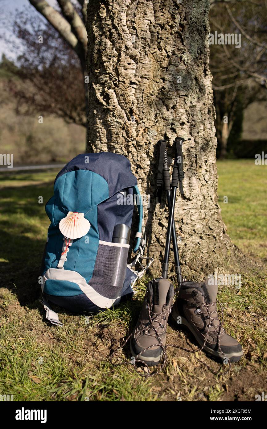 Backpack with seashell symbol of Camino de Santiago, trekking boots and ...