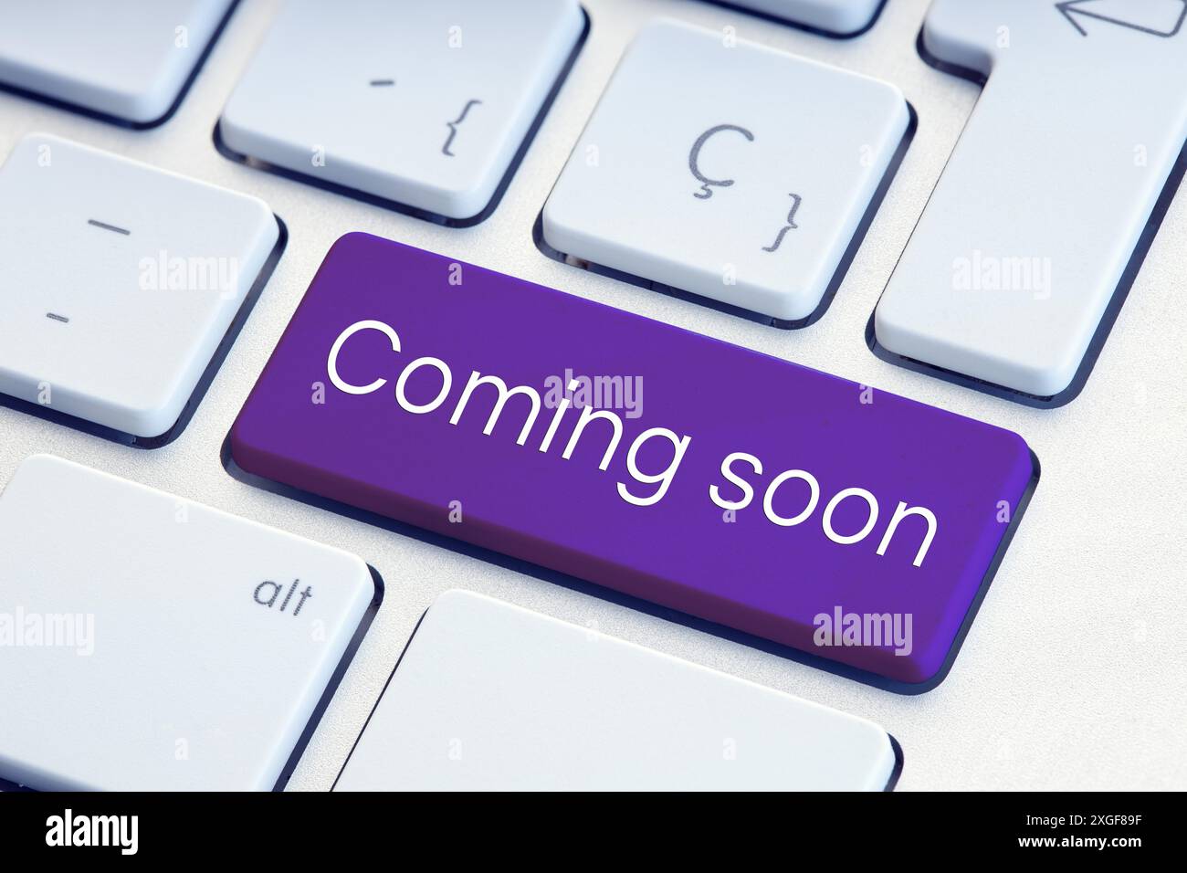 Coming soon phrase on computer Keyboard Key Stock Photo - Alamy