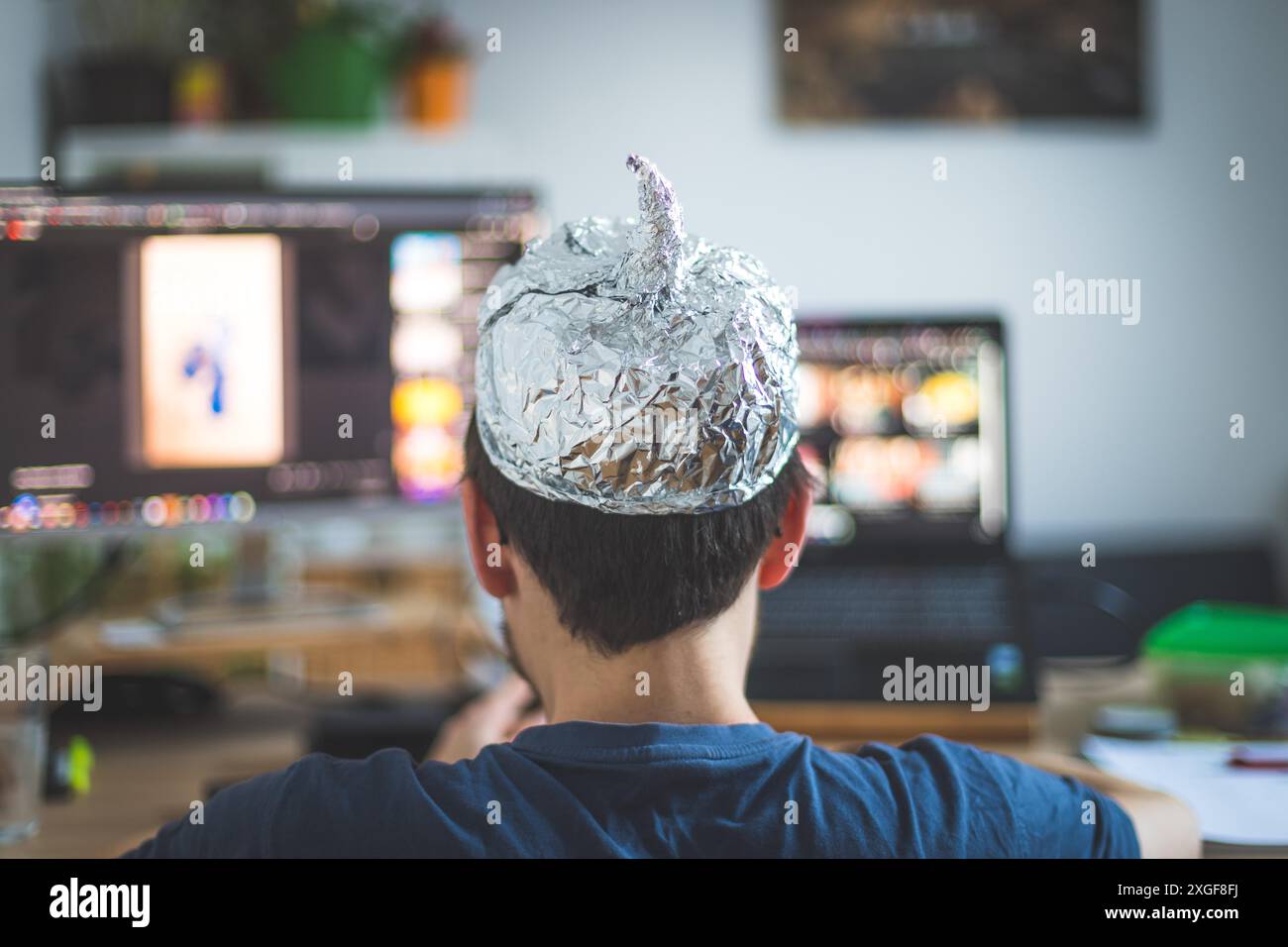 Young man is wearing aluminum cap, conspiracy theory concept Stock ...