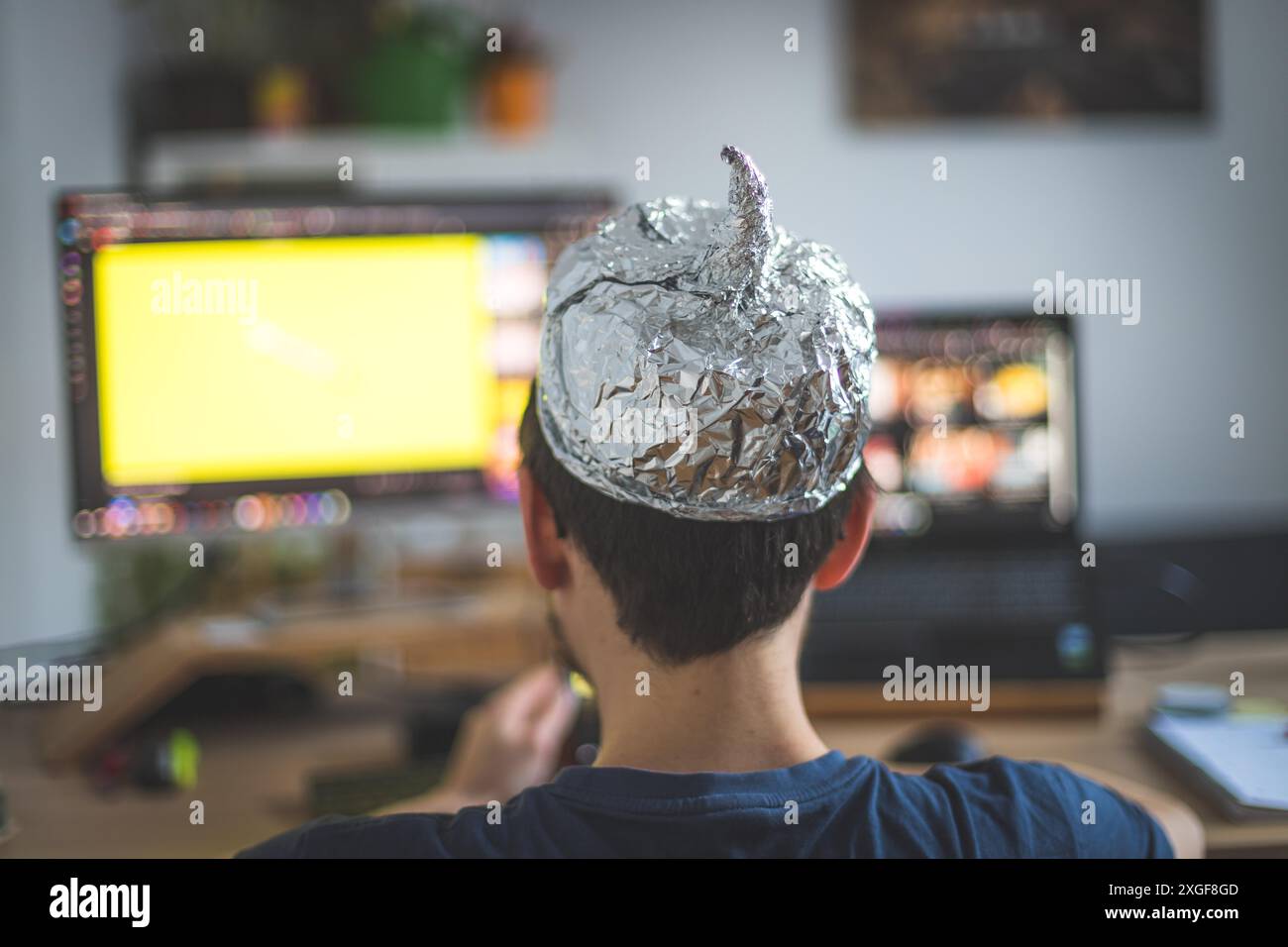 Young man is wearing aluminum cap, conspiracy theory concept Stock ...