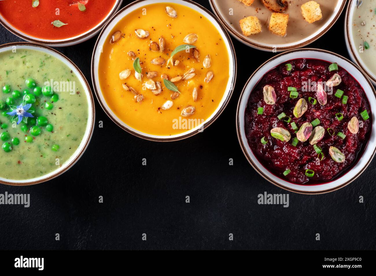 Vegan cream soup banner with copy space. Various vegetable soups, top ...