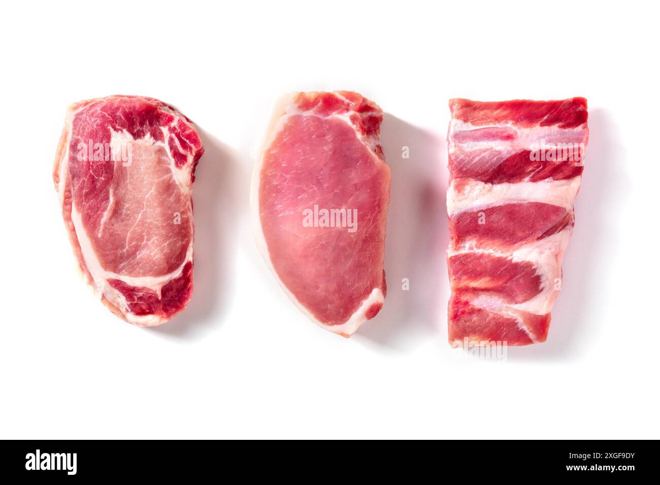 Pork meat, various cuts, overhead flat lay shot on a white background ...