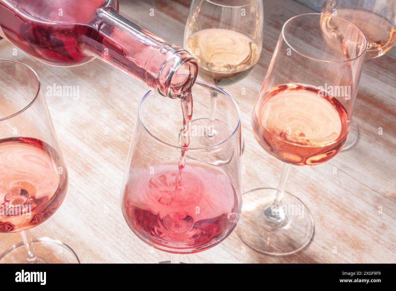 Rose wine poured into a glass, a wine tasting or a party Stock Photo ...