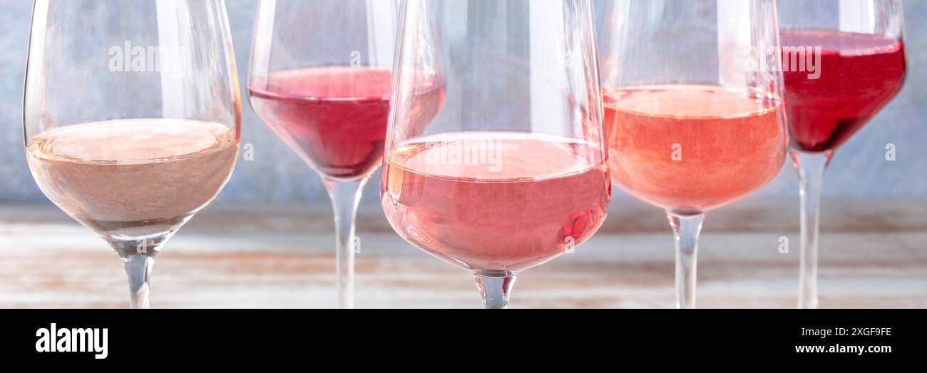 Rose wine panorama, various tints of pink wine, side view Stock Photo ...