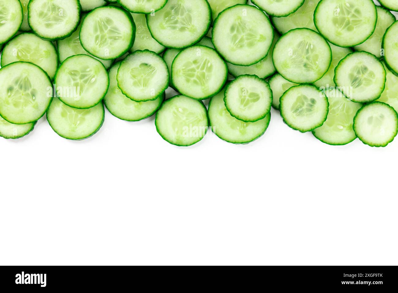 Cucumber background with copy space, overhead flat lay shot on a white ...