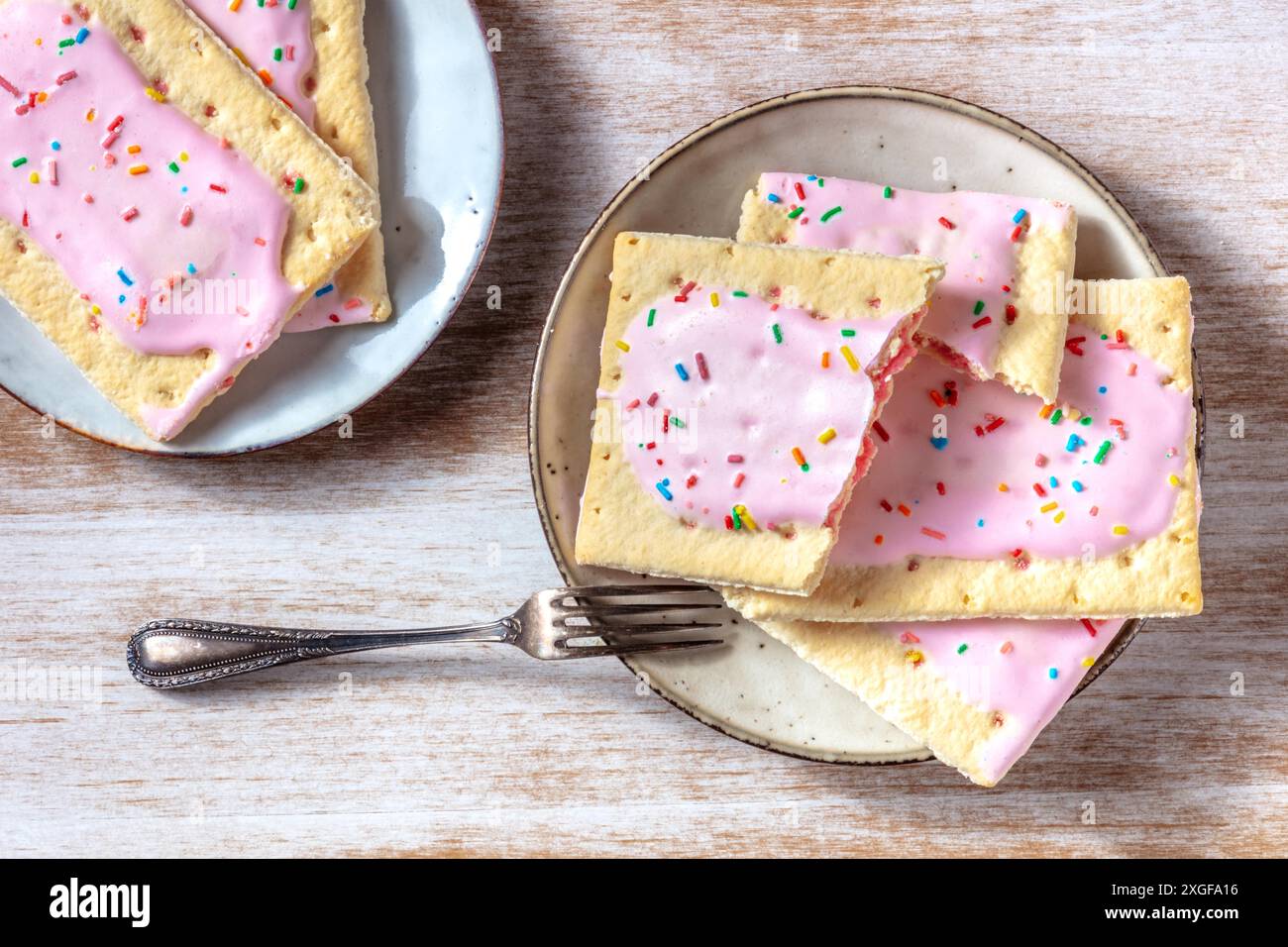 Strawberry pop tarts, American breakfast, top shot on a rustic wooden ...