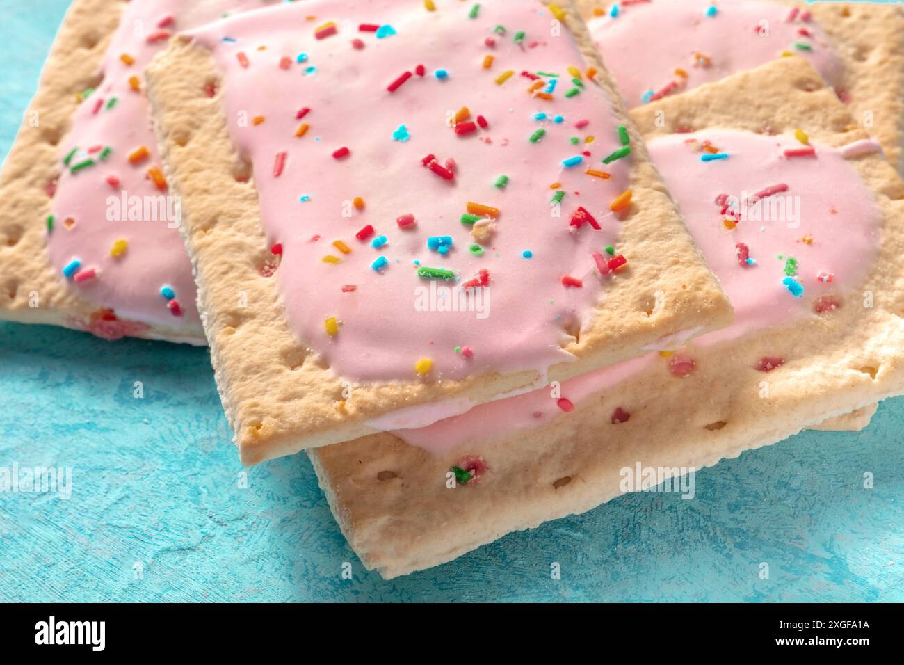 Strawberry pop tart close-up on a blue background. Toaster pastry Stock ...