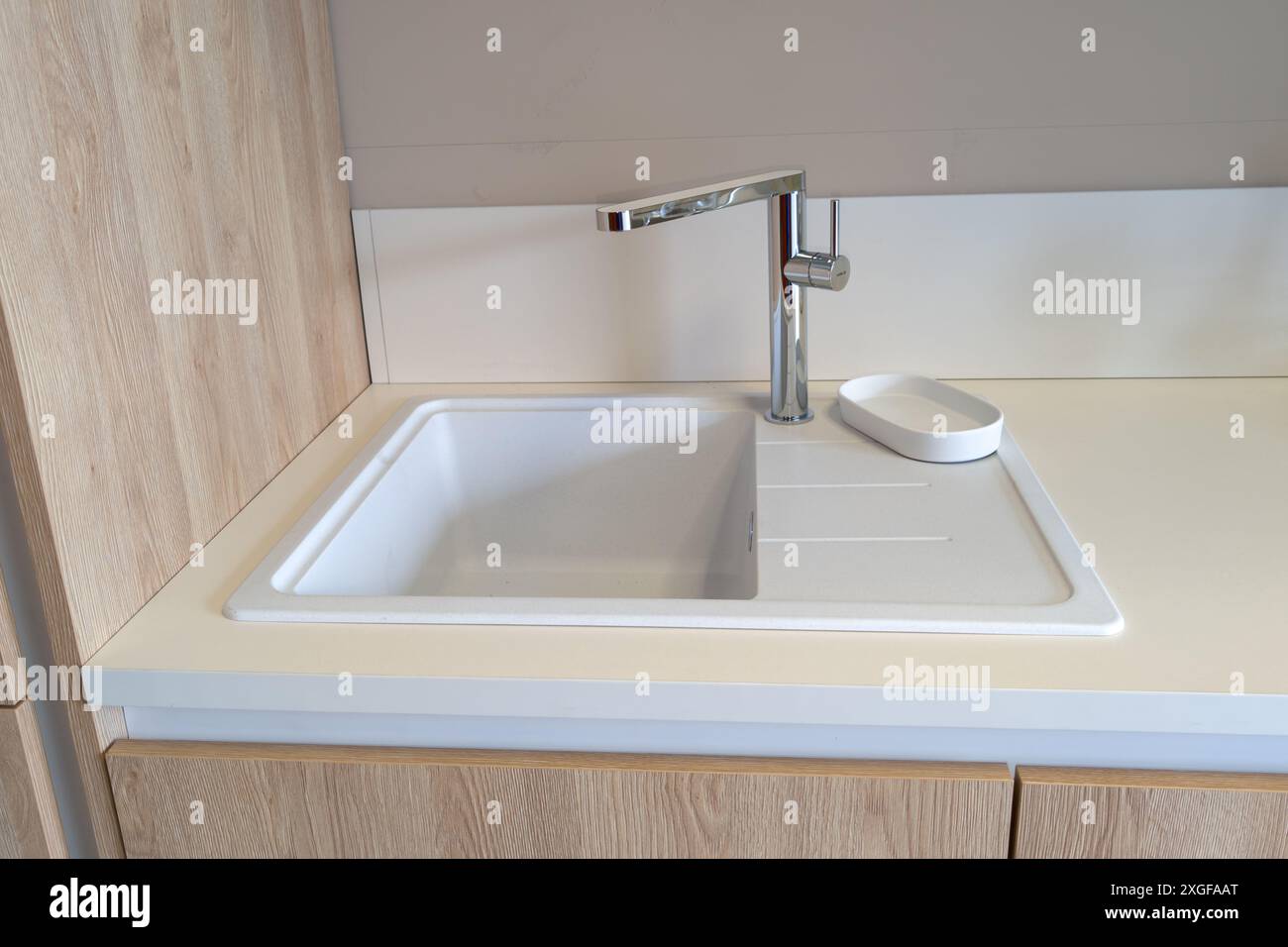 Minimalist kitchen with white clean sink modern Stock Photo - Alamy