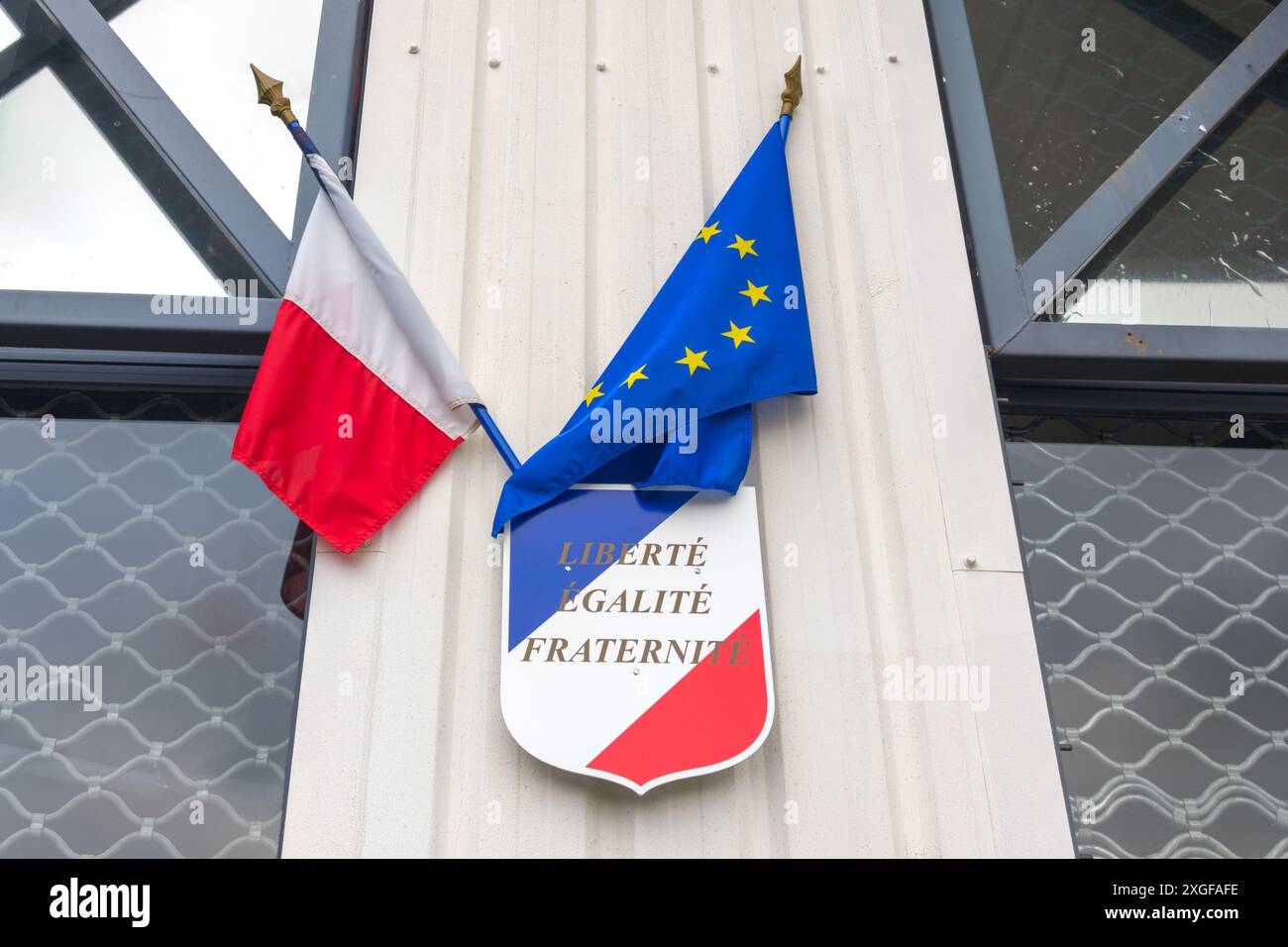 Flags of the European Union and France on city hall facade with french ...