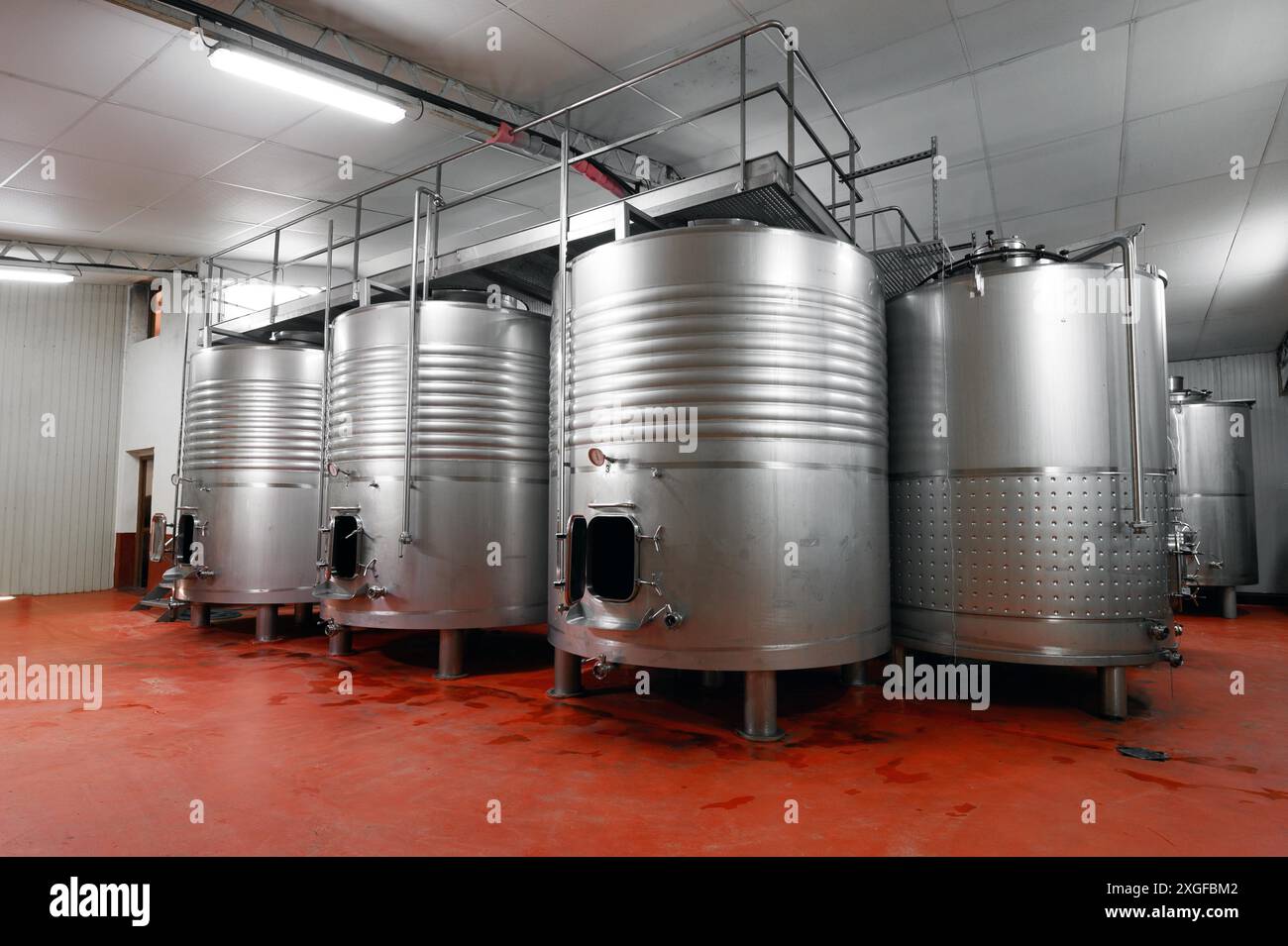 Industrial stainless steel vats in modern brewery. High quality photo ...