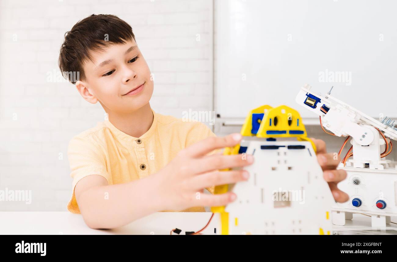 Boy assembling robot table hi-res stock photography and images - Alamy