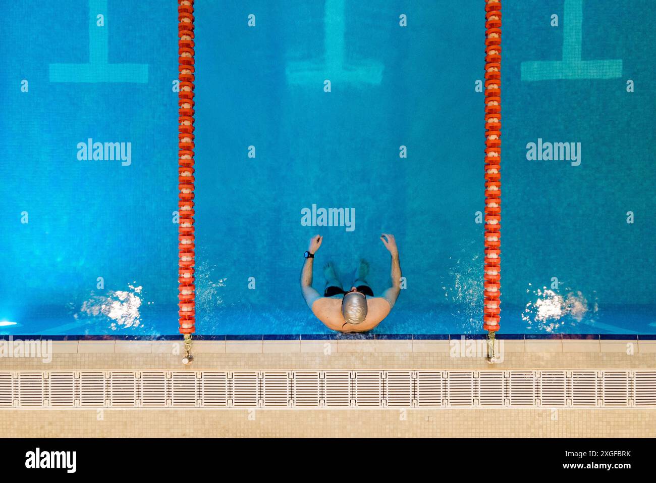 Aerial, drone top down view of professional swimmer, swimming in the ...