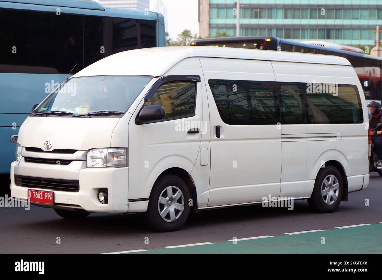 Car on the road, luxury and comfort Minivans vehicle Toyota HiAce white ...