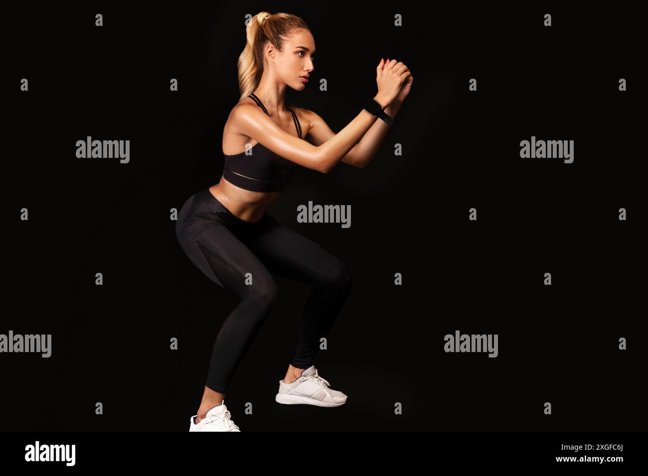 Fitness Girl Doing Deep Squat Exercise Over Black Studio Background ...