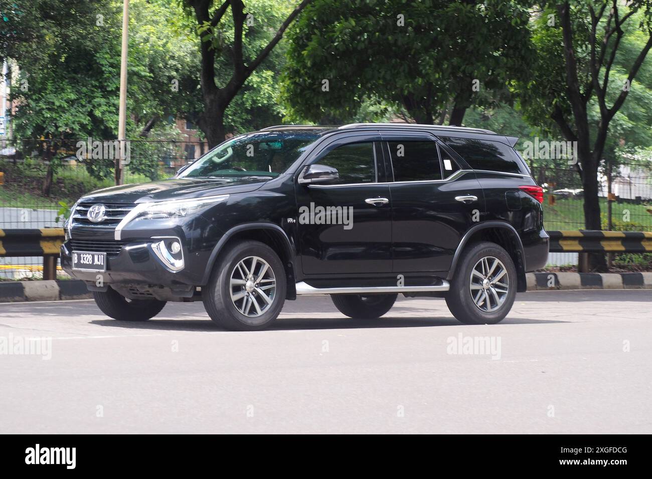 SUV four wheel drive, black Toyota Fortuner, in a road, at business and commercial distric TB ...