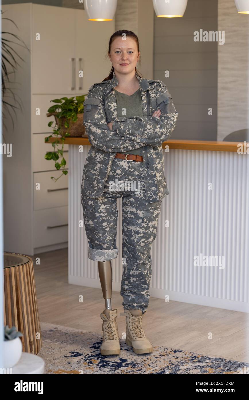 Woman in undefined uniform standing confidently with prosthetic leg in ...
