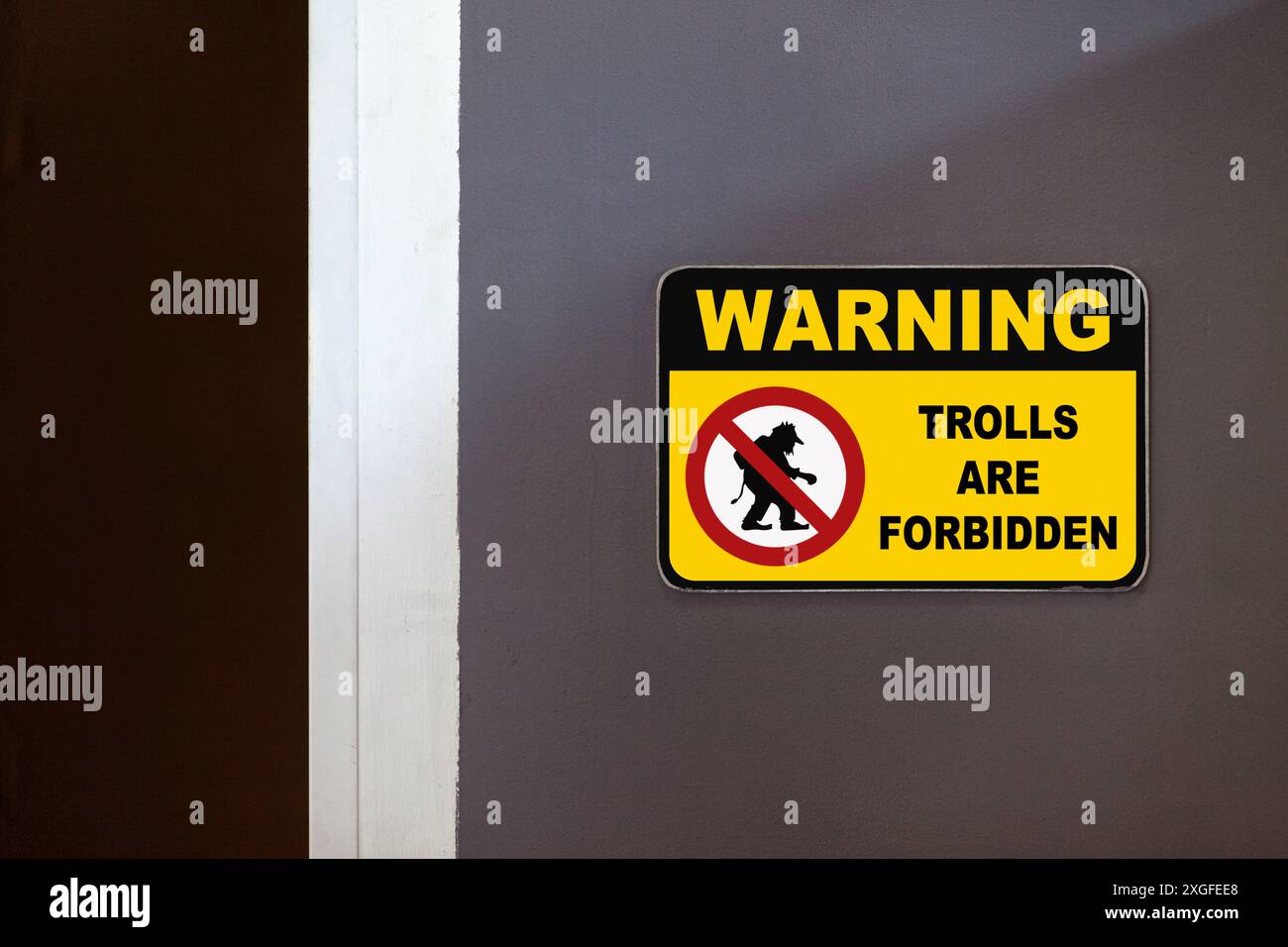 Yellow and black warning sign on the side of an open door stating in ...