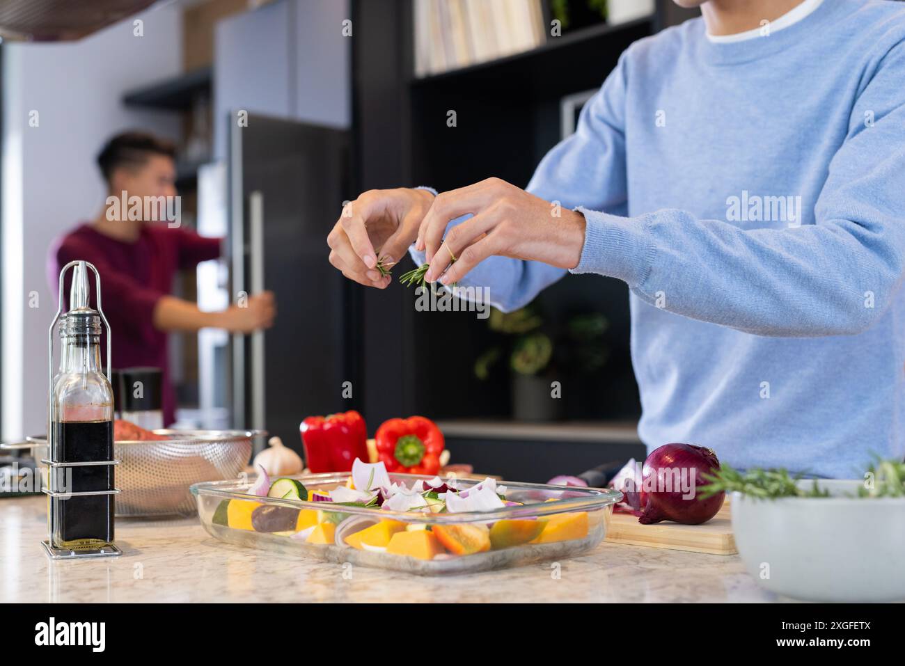 Chef adding herbs pan vegetables hi-res stock photography and images ...