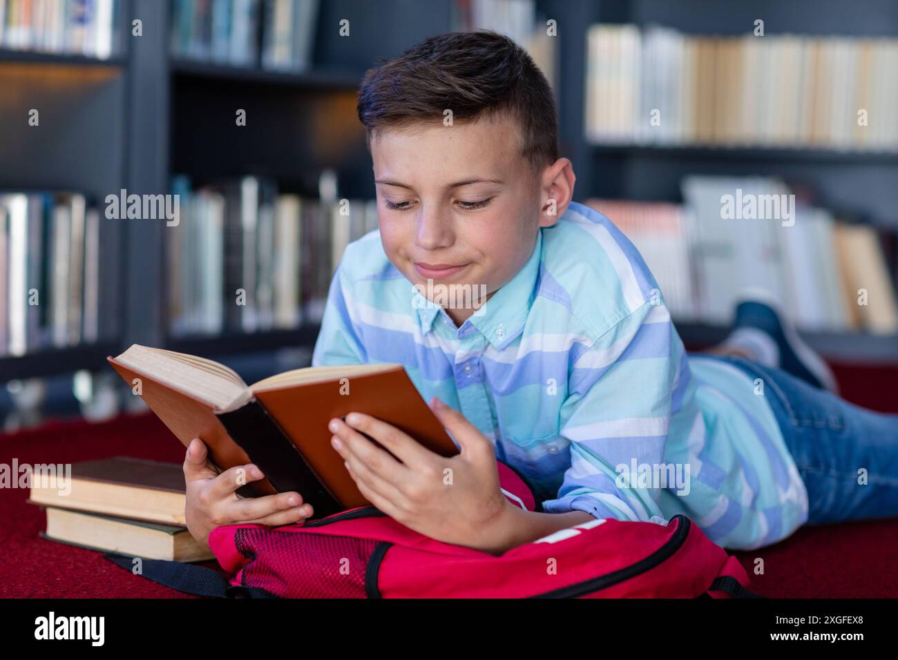 Little schoolboy reading book in hi-res stock photography and images ...