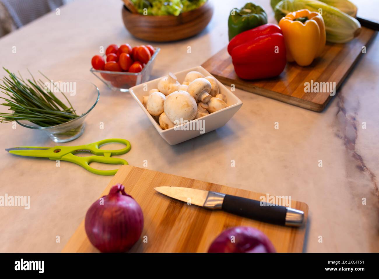 Preparing fresh vegetables, kitchen counter with mushrooms, peppers ...