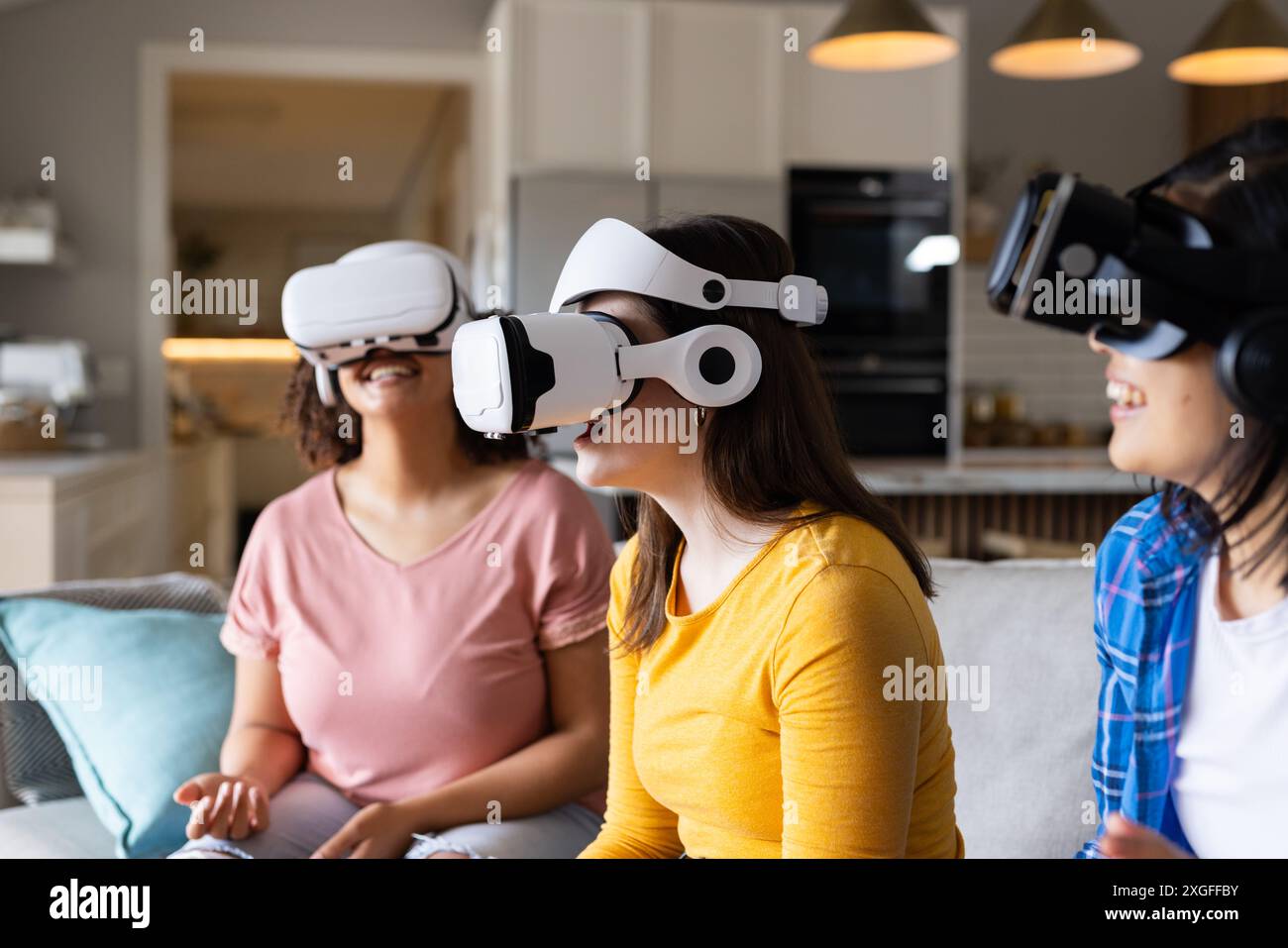 Using vr headsets diverse female hi-res stock photography and images ...