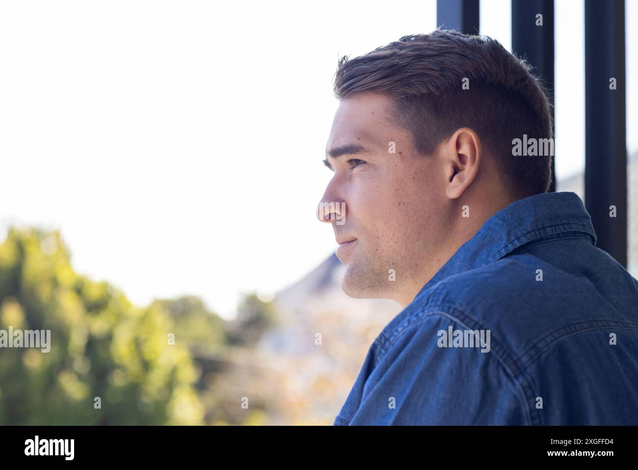 Man gazing thoughtfully out hi-res stock photography and images - Alamy