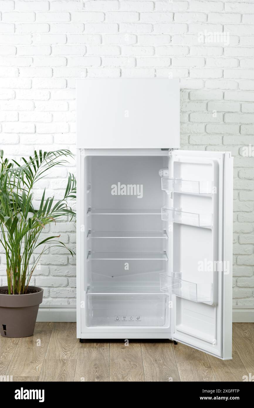 White Refrigerator Open Against Brick Wall Stock Photo - Alamy