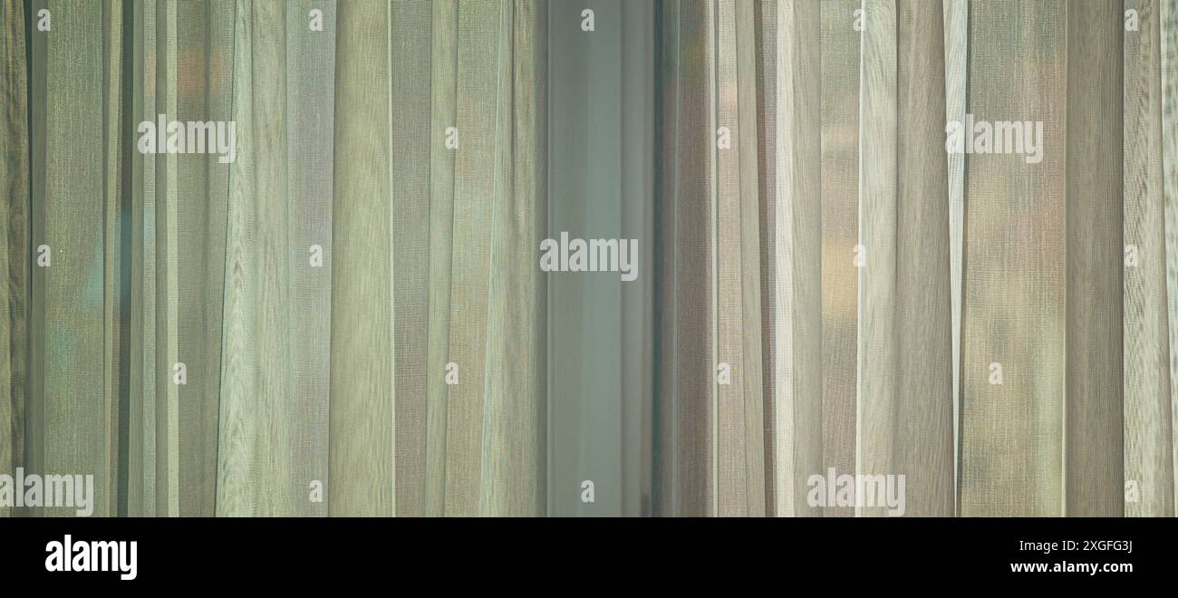 Bright light coming from the living room window through white curtains ...