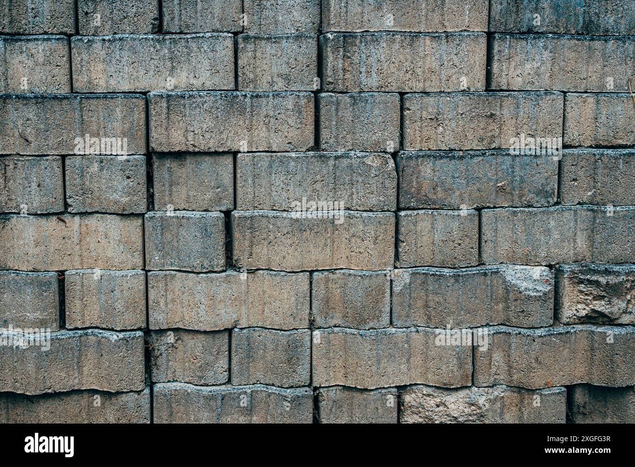 Concrete paving blocks stacked on construction site, background and ...