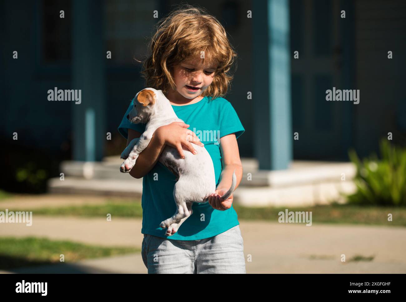 Happy child hugging a dog, boy with pet Stock Photo - Alamy