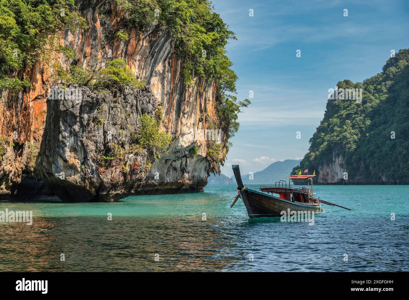 Tropical islands view with long tail boat and ocean blue sea water at ...