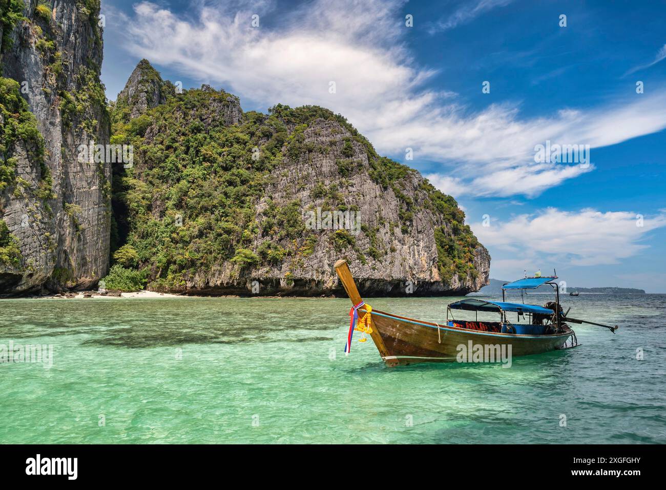 Tropical islands view with long tail boat ocean blue sea water at Pileh ...