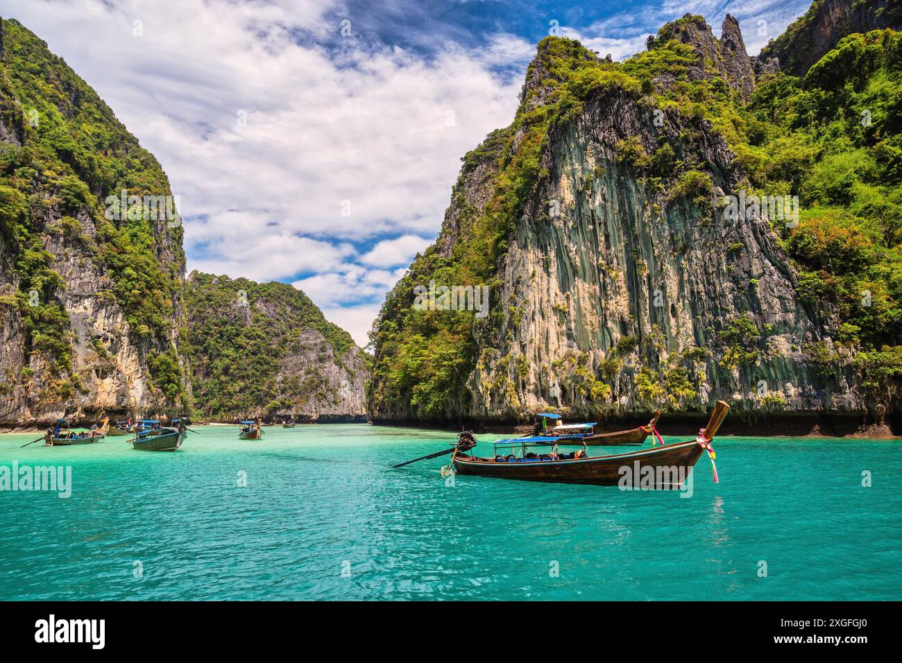 Tropical islands view with long tail boat ocean blue sea water at Pileh ...
