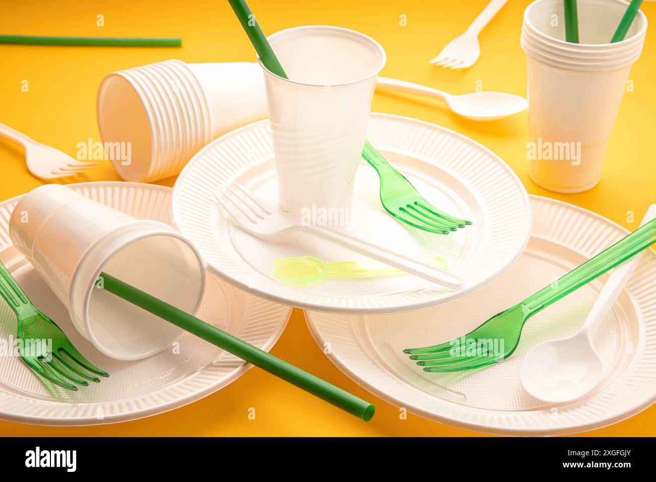 Disposable plastic dishware waste. Group of empty plates, cups, spoons ...