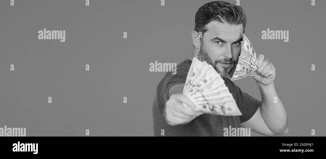 Successful man counting money. Handsome middle age man holding bunch of ...