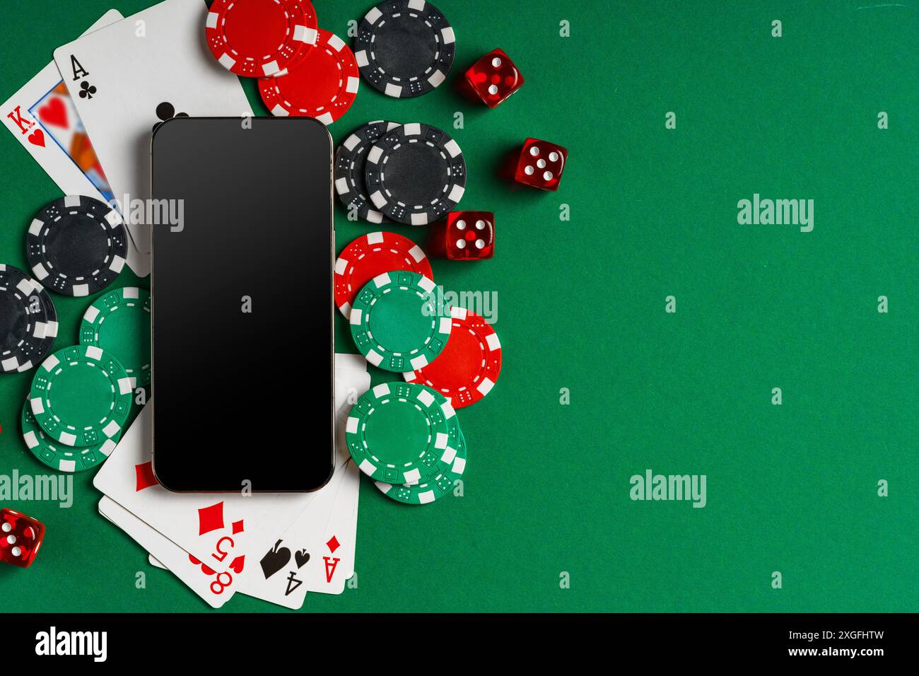 Smartphone With Playing Cards and Chips on a Green Felt Tabletop Stock ...