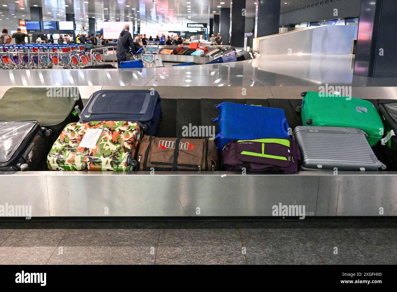 Airport baggage claim carousel baggage Stock Photo - Alamy