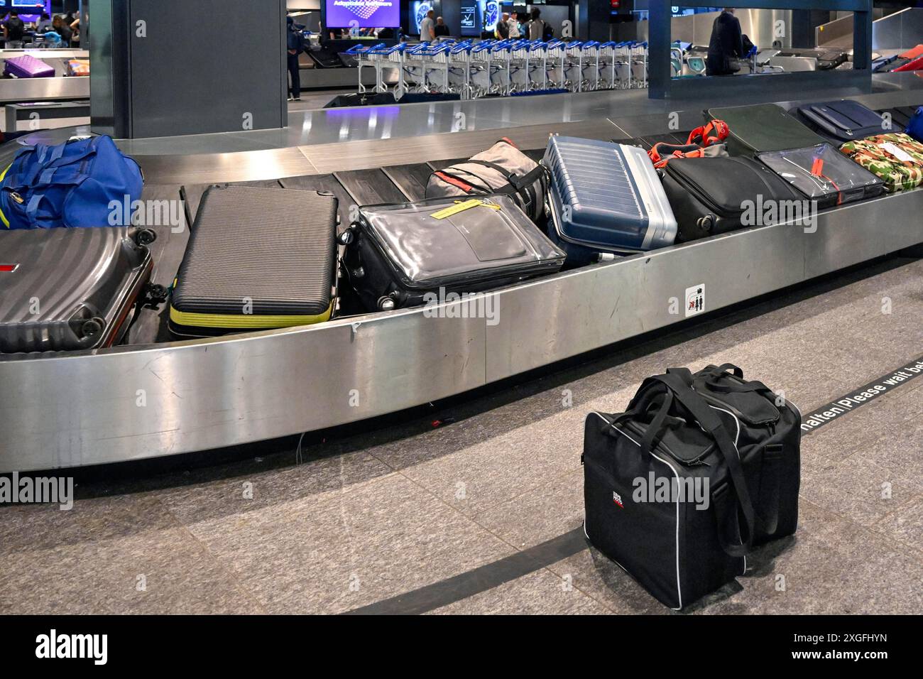 Airport baggage claim carousel baggage Stock Photo - Alamy