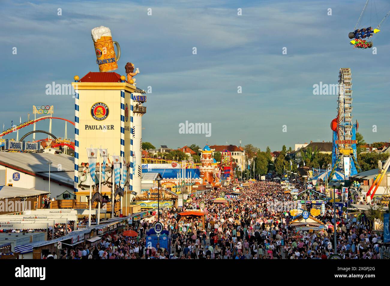 View over the Wies'n with tower of Paulaner beer tent, Ferris wheel and ...