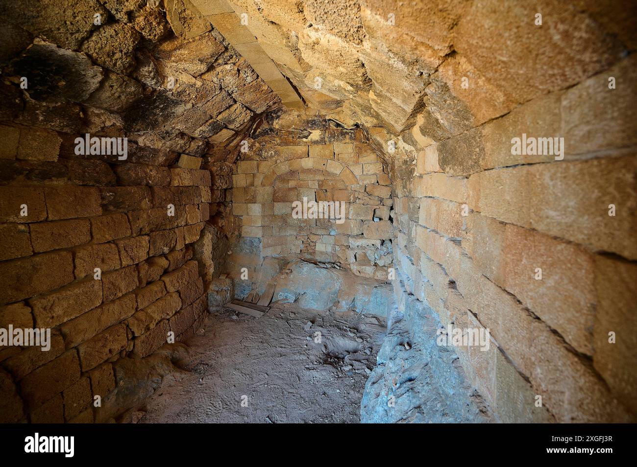 Interior view of an old building with stone walls and vaulted ceiling ...