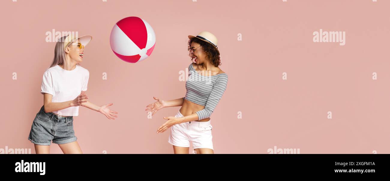 Women on beach with ball hi-res stock photography and images - Alamy