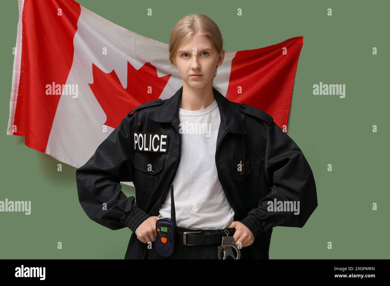 Female police officer and flag of Canada on green background Stock ...