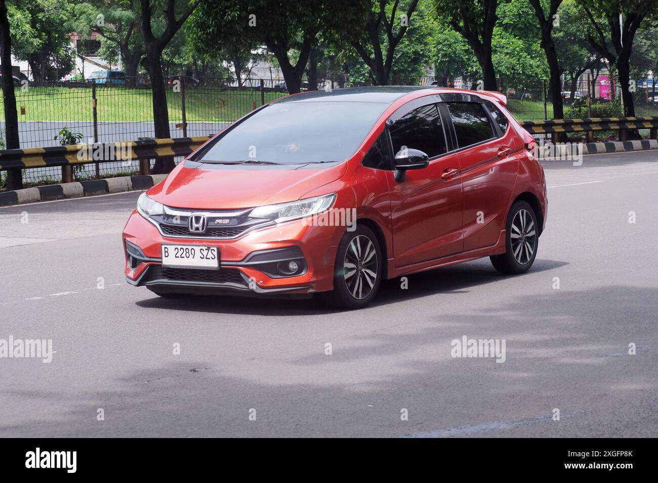 red car Honda Jazz driving in TB Simatupang street, Jakarta, Indonesia ...