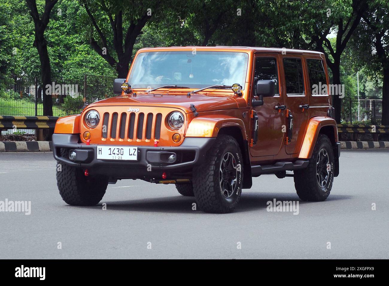 luxury car a brown 4 wheels drive Jeep Rubicon, drive at TB Simatupang ...