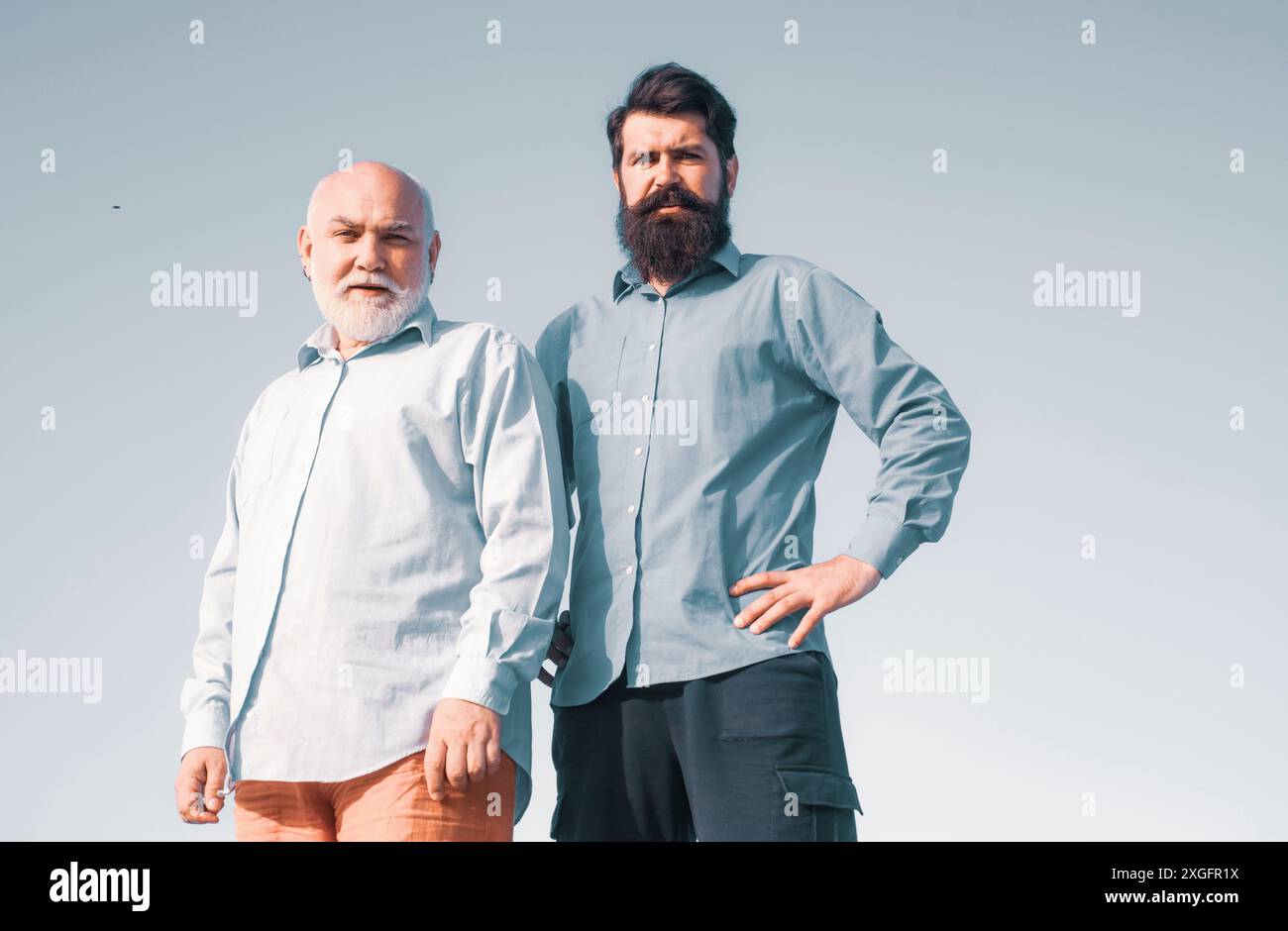 Two generations ages: grandfather and father together. Generation of ...