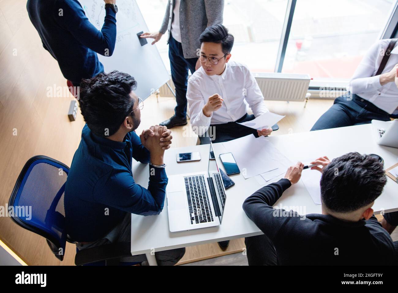 Multiracial team group disputing hi-res stock photography and images ...
