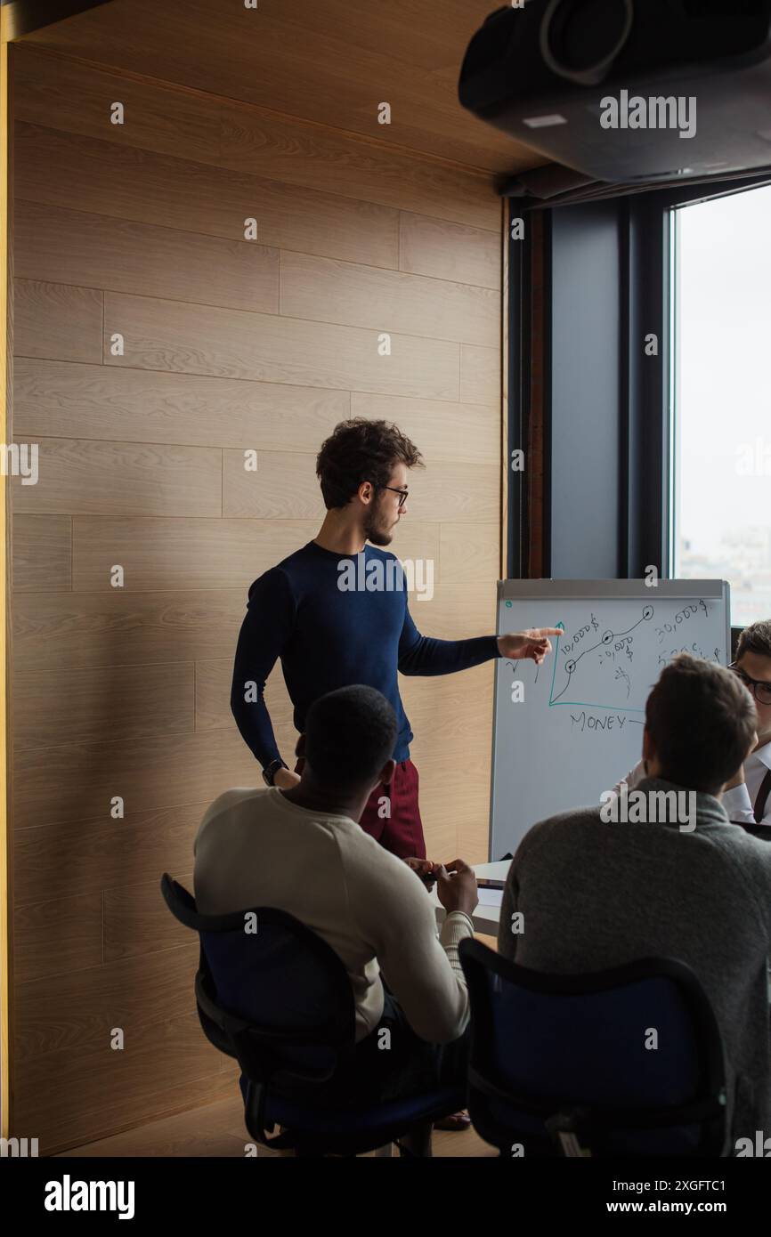 Group of multiethnic male arhitecture designers in casual wear gathered ...
