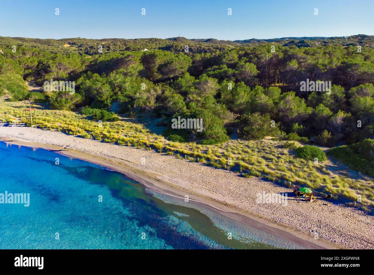 Aerial view of Es Grau beach in Menorca during a sunny summer day ...